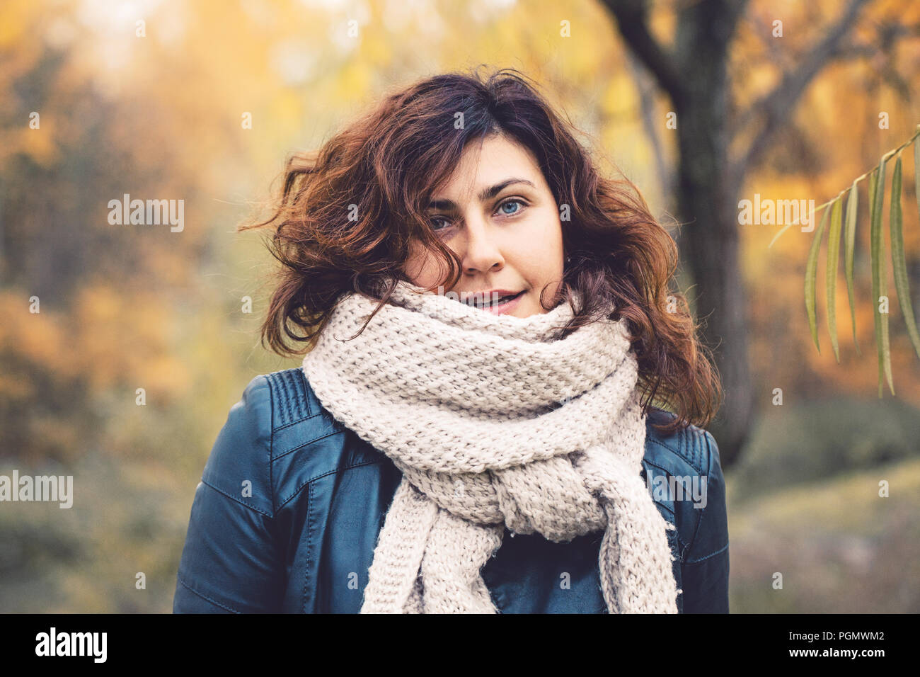 Real woman portrait. Autumn woman in fall park outdoors Stock Photo - Alamy