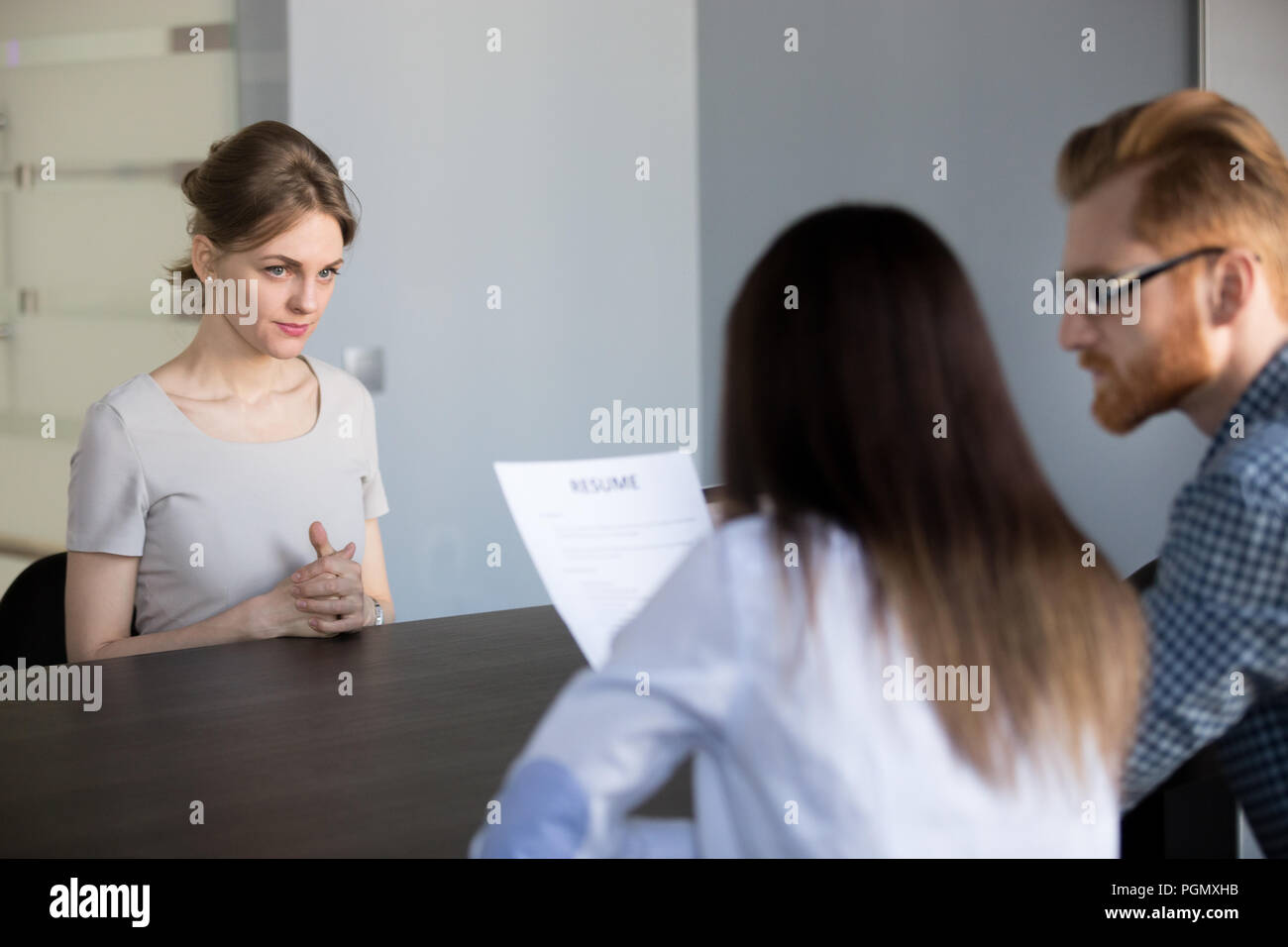 Worried female employee waiting during job interview Stock Photo - Alamy