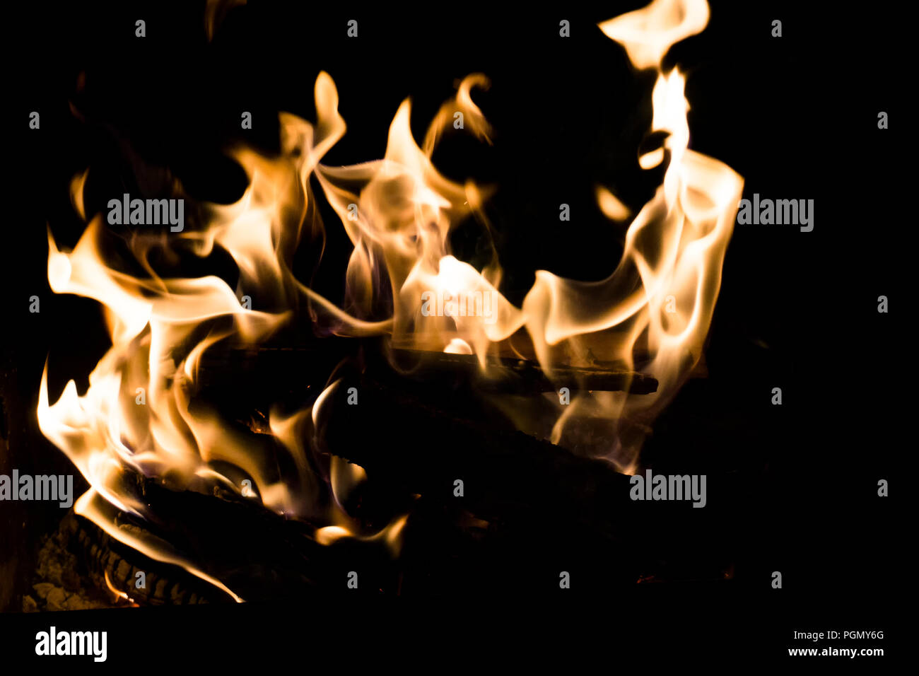Red fire flame on black background at night Stock Photo - Alamy