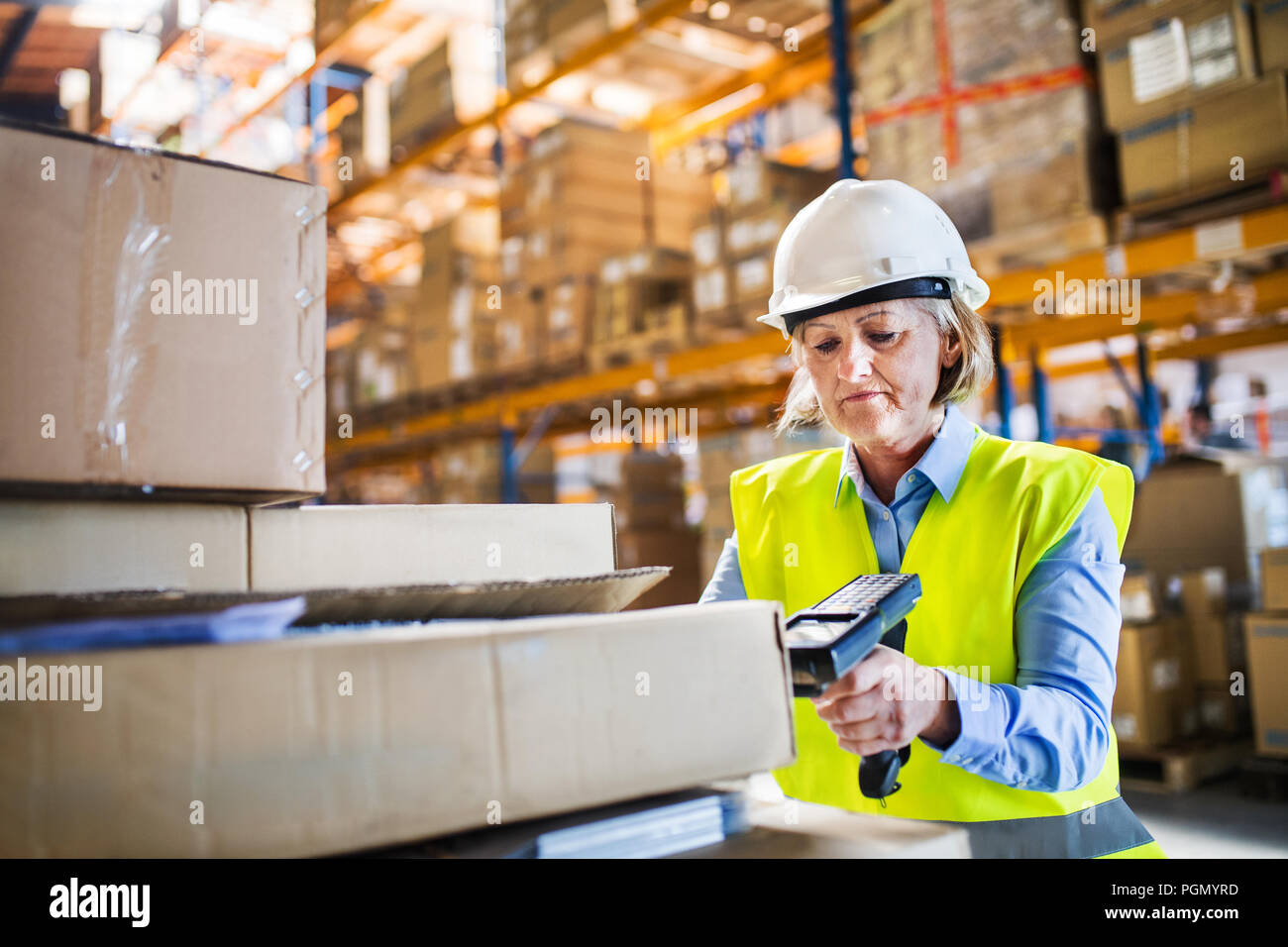 Using handheld scanner warehouse hi-res stock photography and images ...