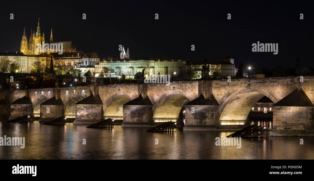 Charles Bridge crossing the Vltava with St. Vitus Cathedral and Prague ...