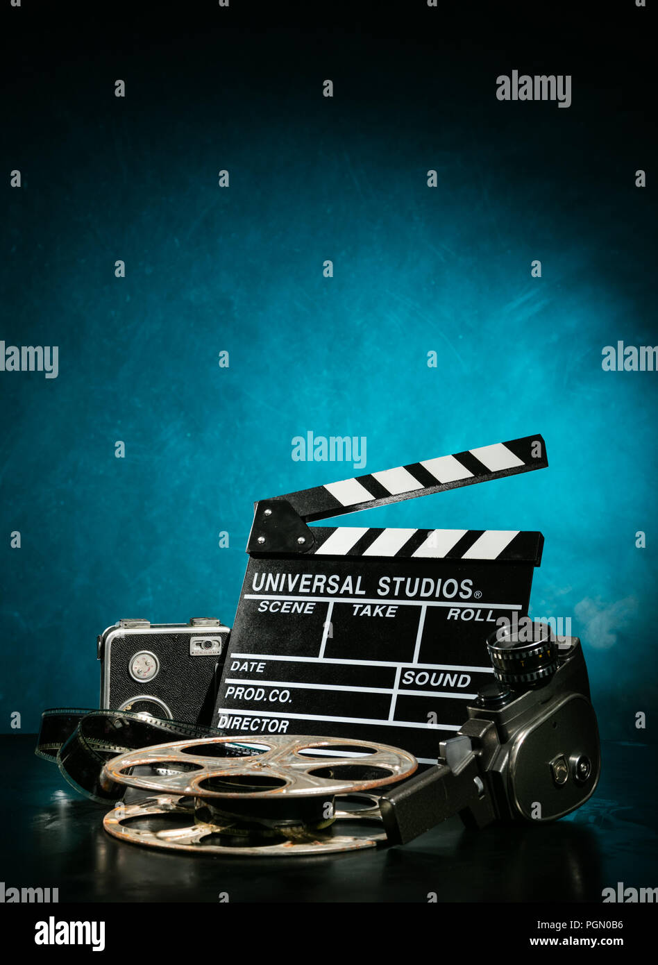 Vintage film claper with film reel and camera. filmmakers equipment ...