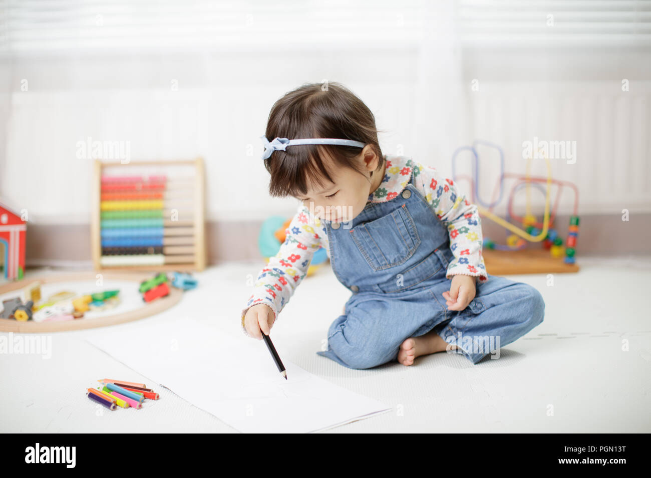 baby girl learning draw at home Stock Photo - Alamy