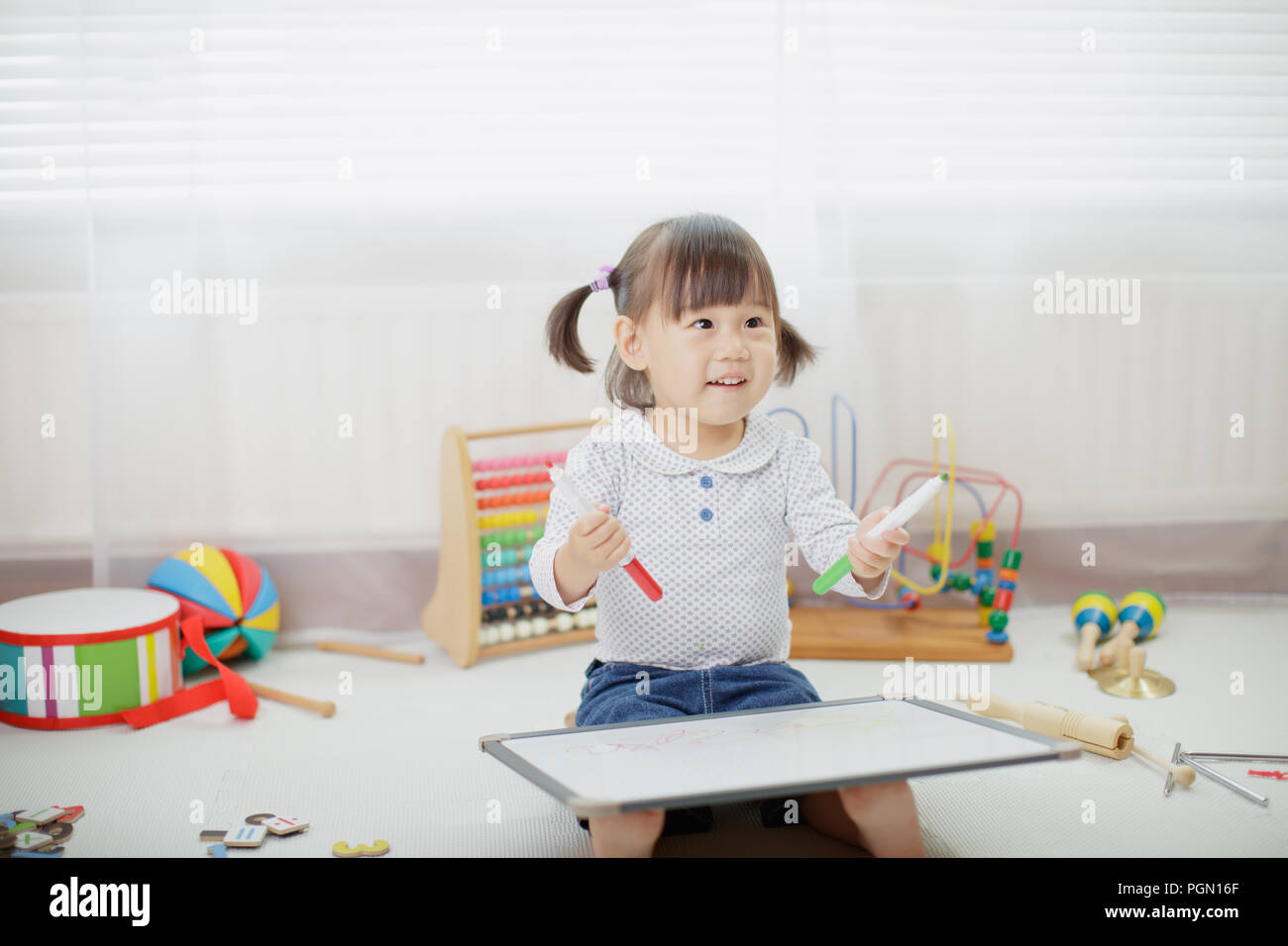 baby girl learning draw at home Stock Photo - Alamy