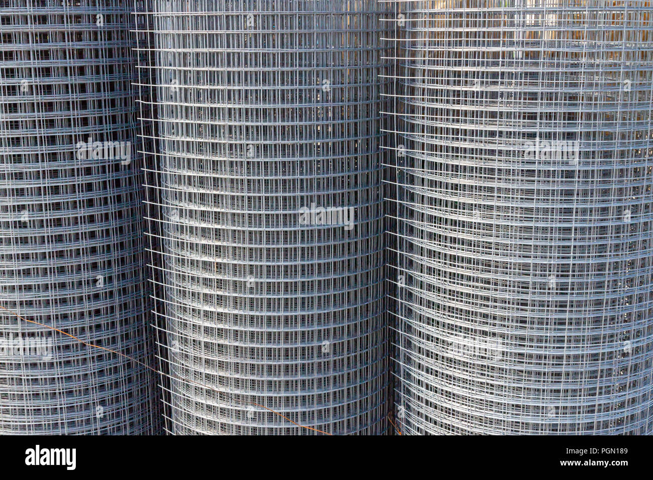Metal mesh for construction wound into a roll Stock Photo - Alamy