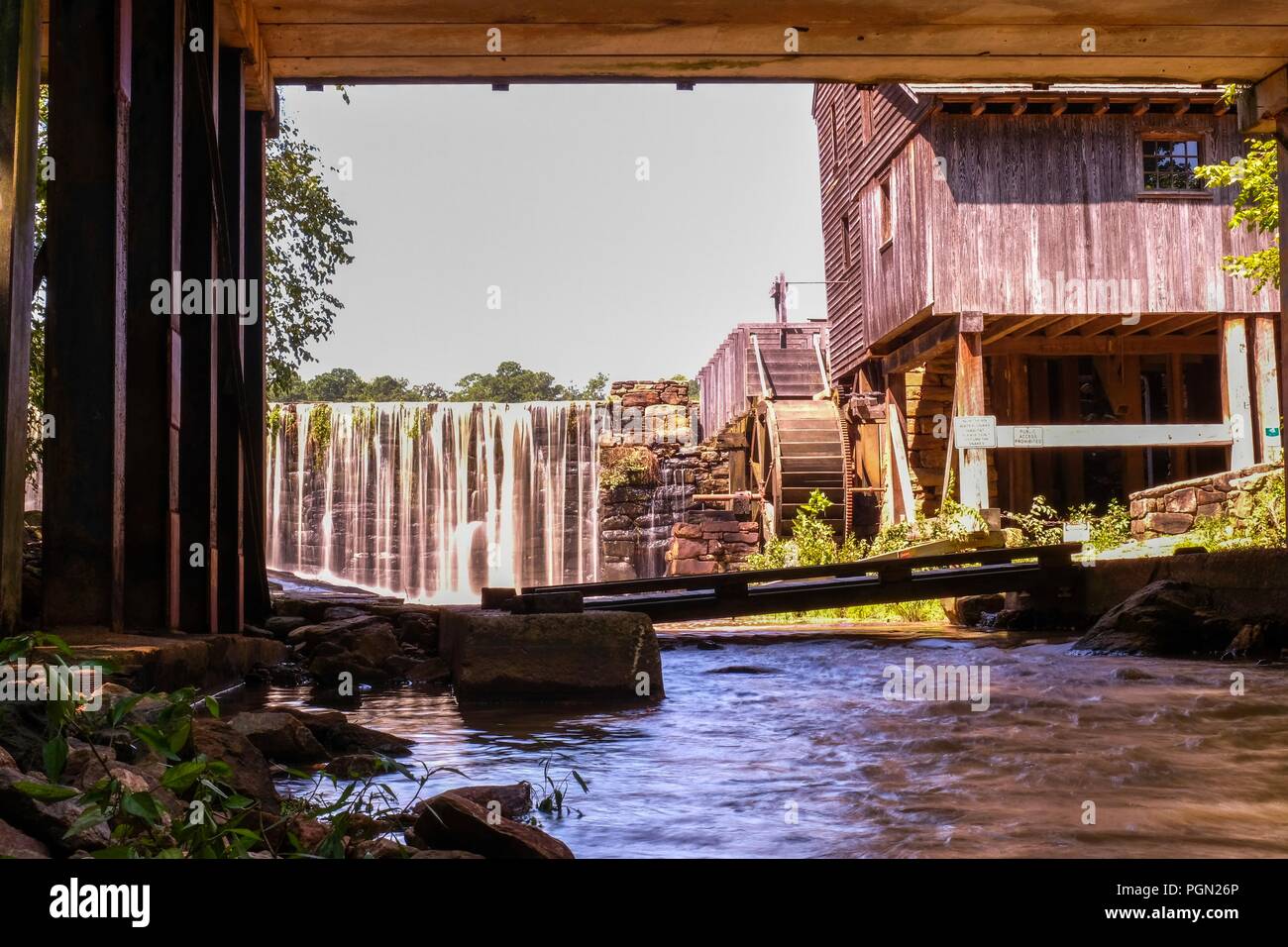 View from under the bridge of the old gristmill at Historic Yates Mill ...