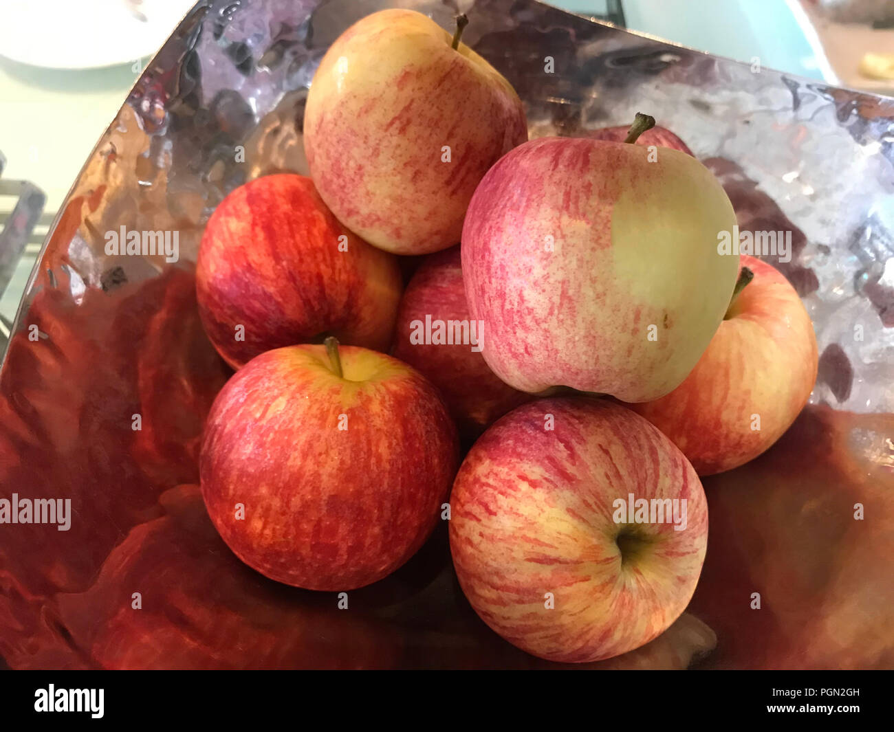 fresh raw red apples fruit stack piling in decorative stainless metal ...