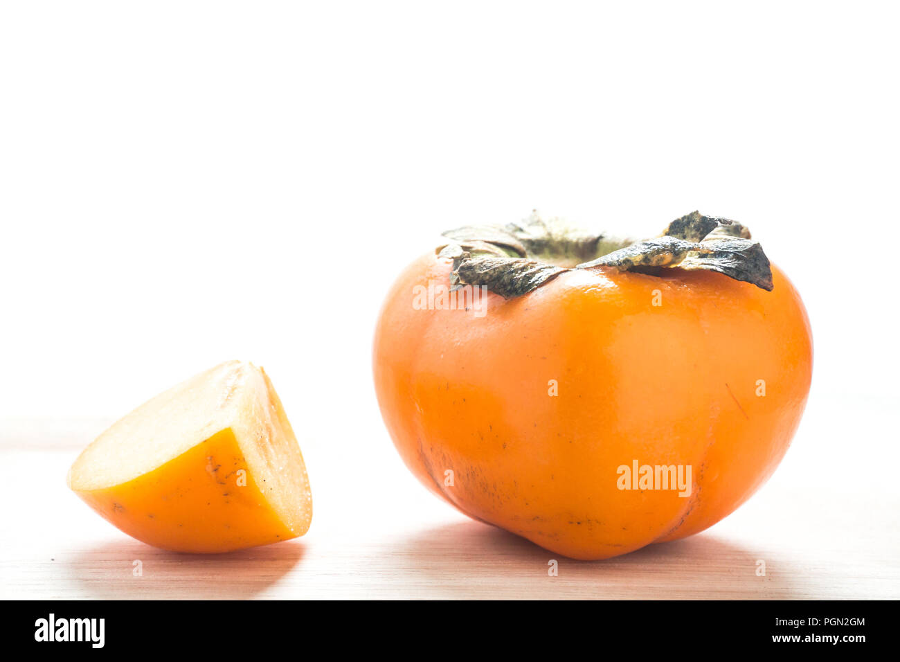 Persimmon on a white background, persimmon orange in front view Stock ...