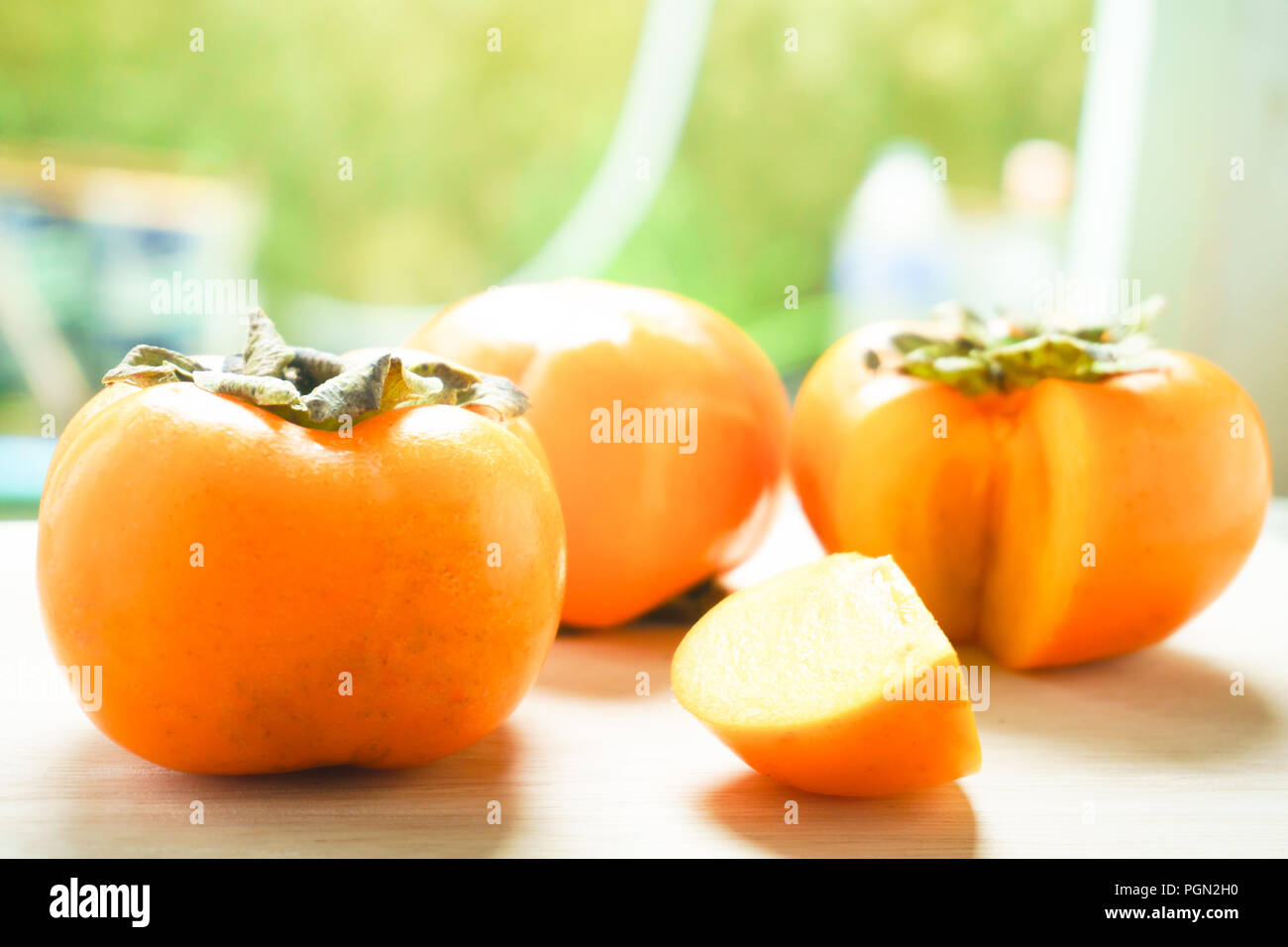Persimmon on a white background, persimmon orange in front view Stock ...
