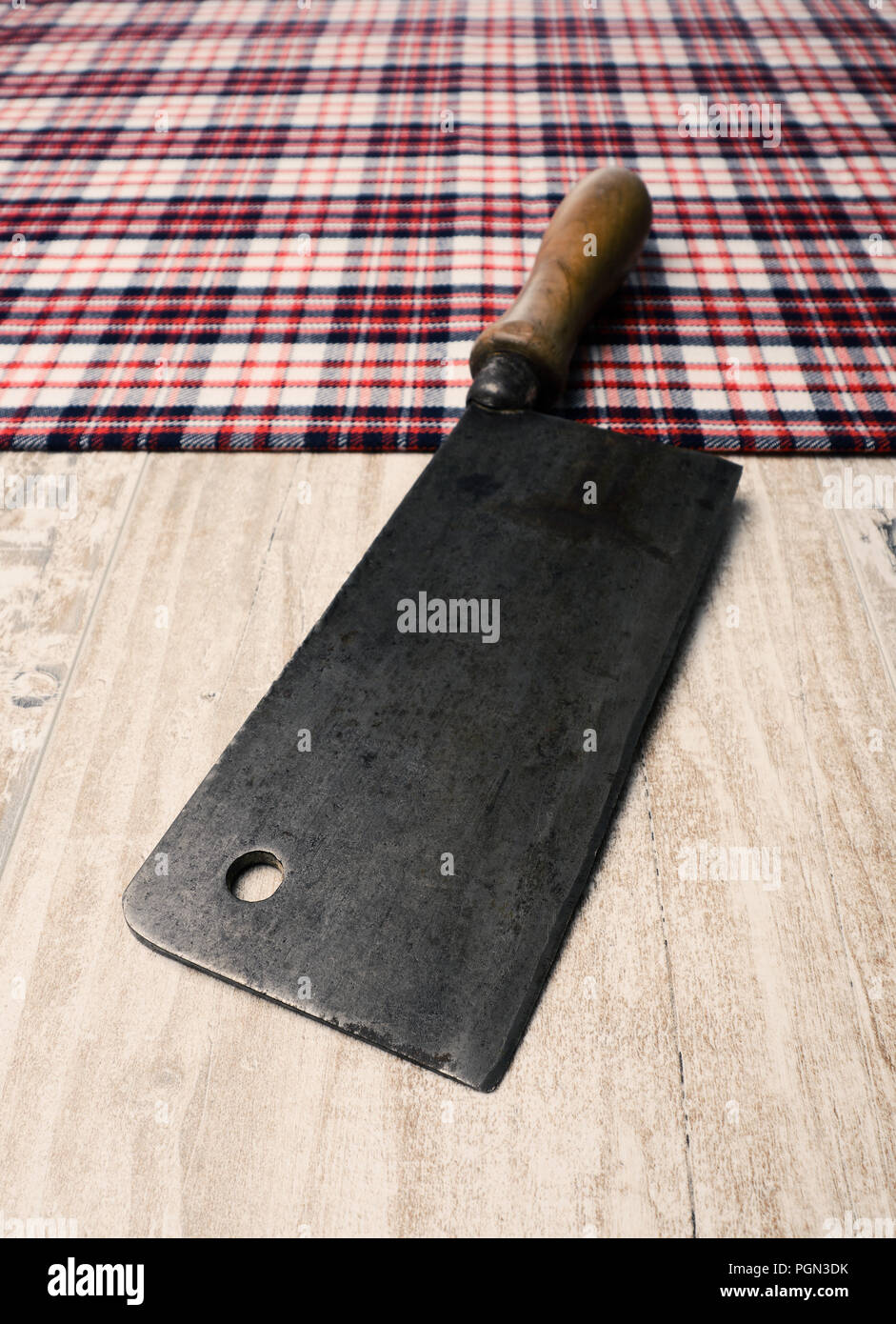 Old meat cleaver on a rustic kitchen table Stock Photo - Alamy