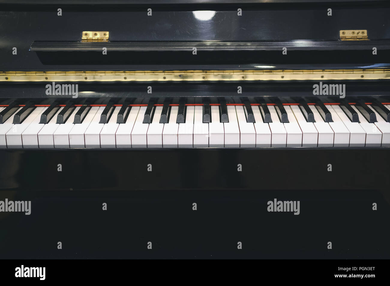 piano keyboard with glossy black & white keys. classic music instrument ...