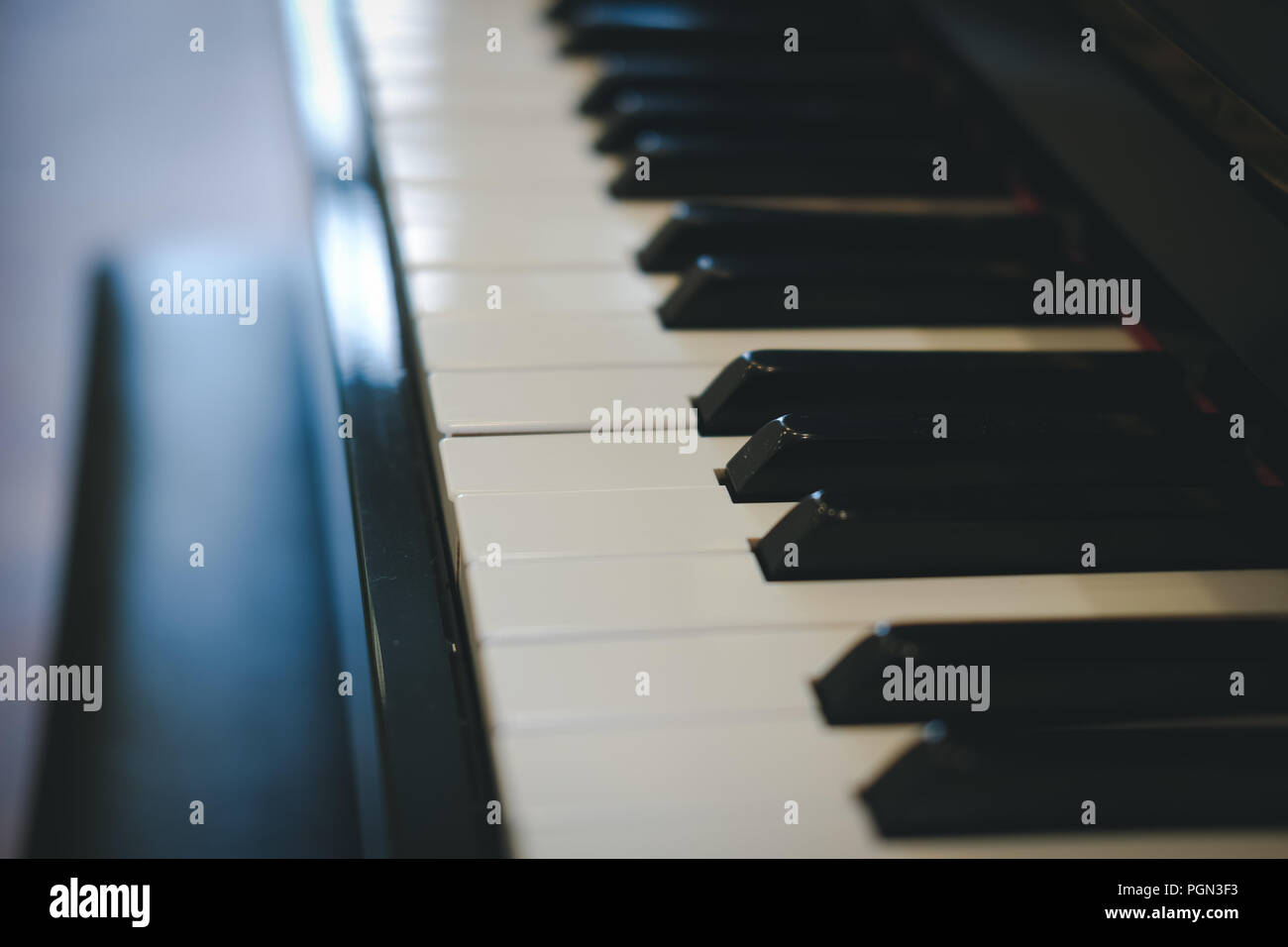 piano keyboard with glossy black & white keys. classic music instrument ...