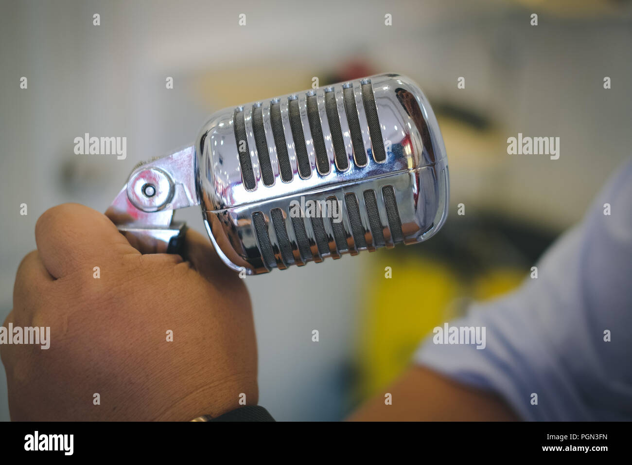 singer hand holding silver chrome metal vintage microphone Stock Photo ...