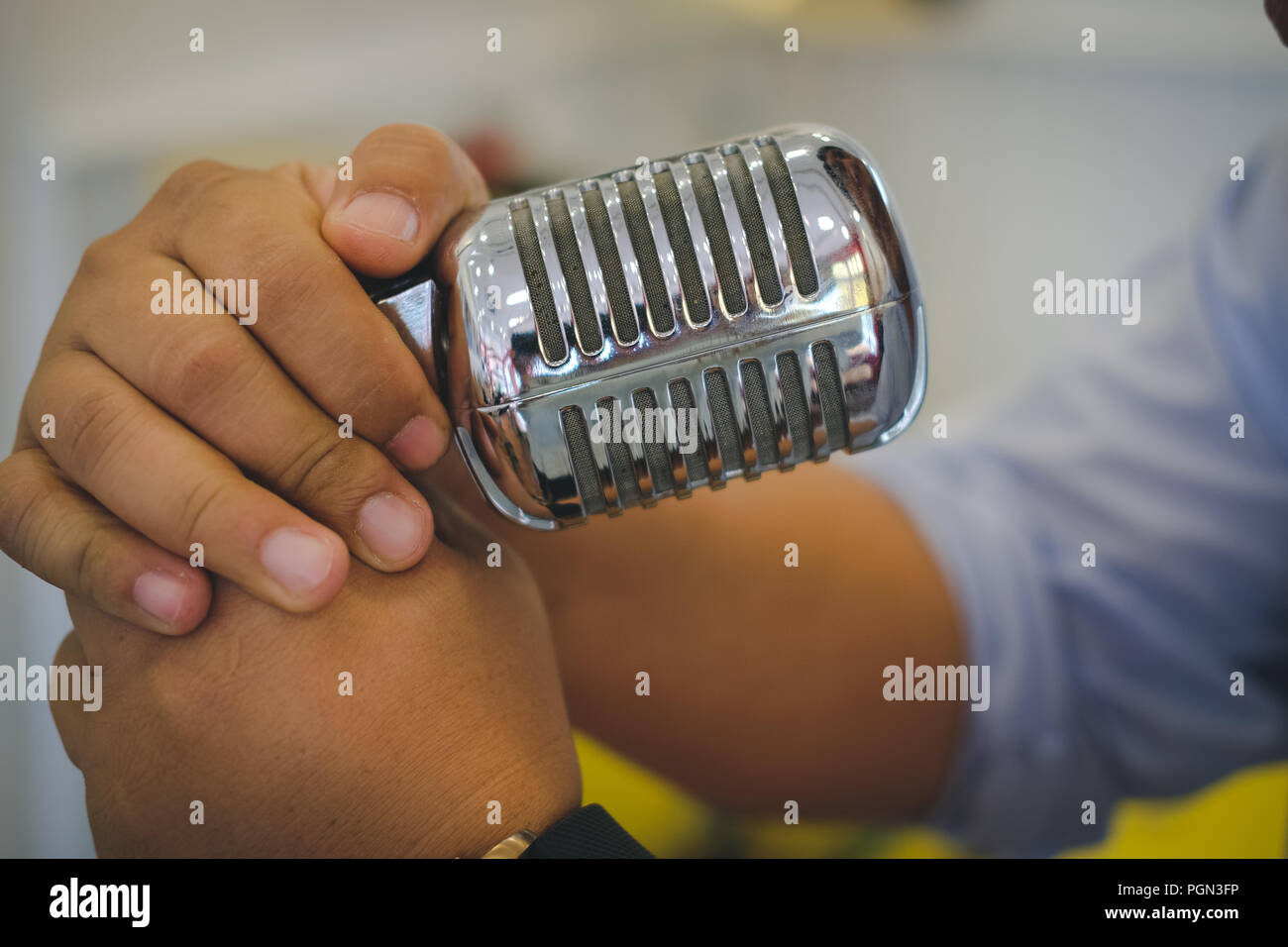 singer hand holding silver chrome metal vintage microphone Stock Photo ...
