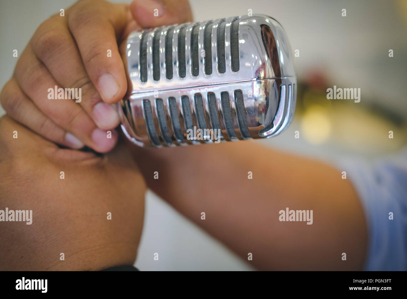 Singer holding retro microphone hi-res stock photography and images - Alamy
