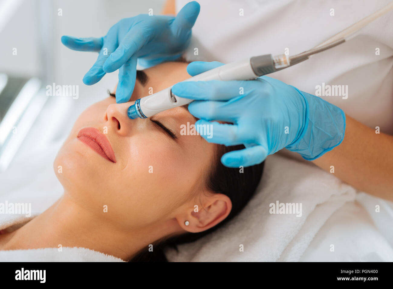 Beautiful nice young woman closing her eyes Stock Photo - Alamy