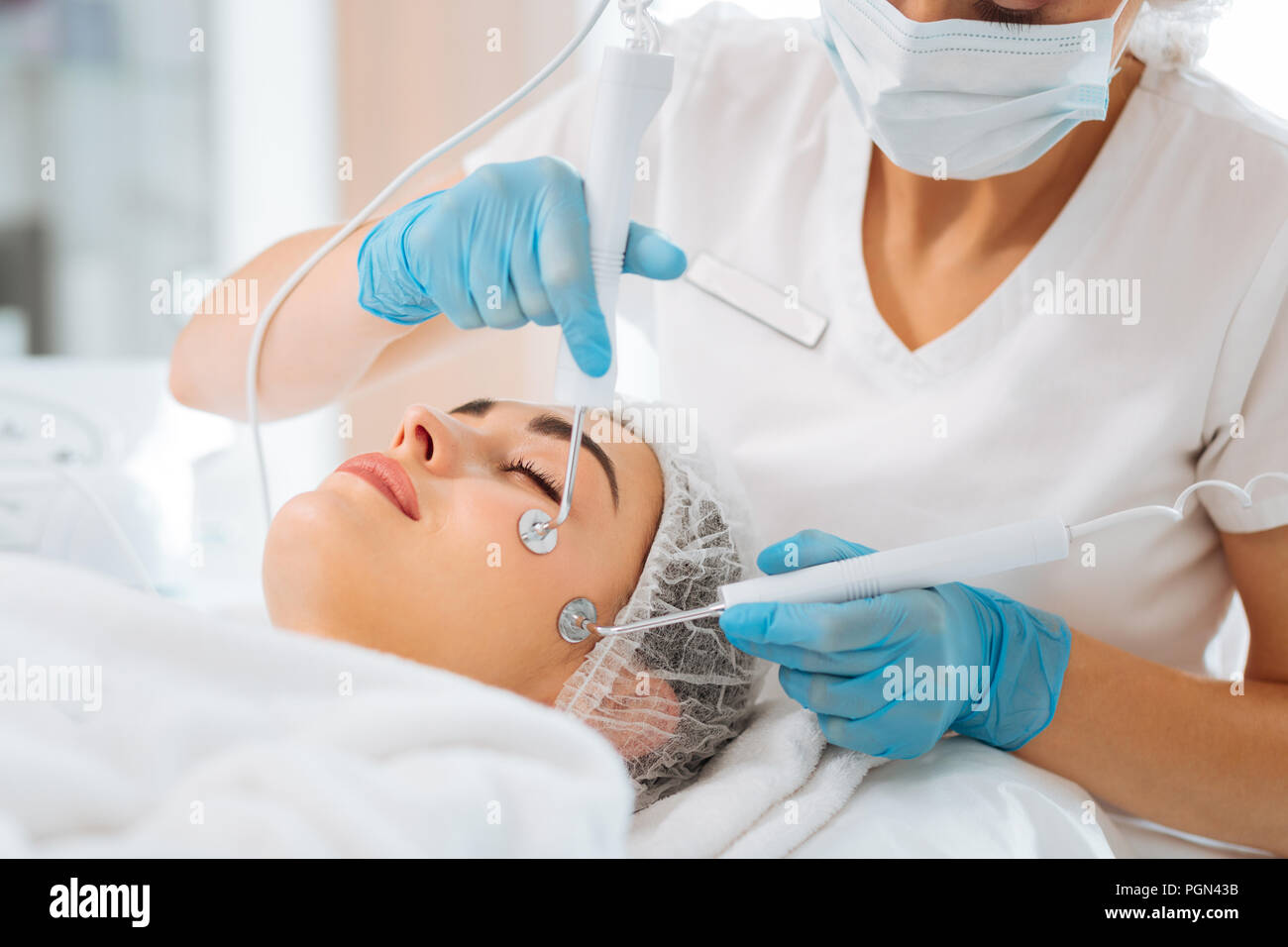 Professional experienced cosmetologist doing a beauty procedure Stock ...