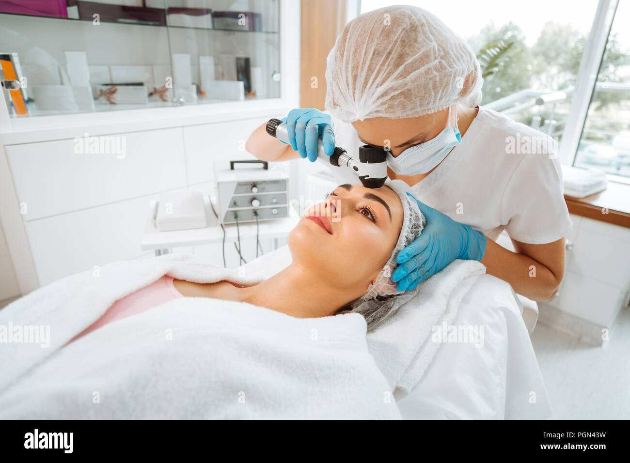 Doctor woman examination skin hi-res stock photography and images - Alamy