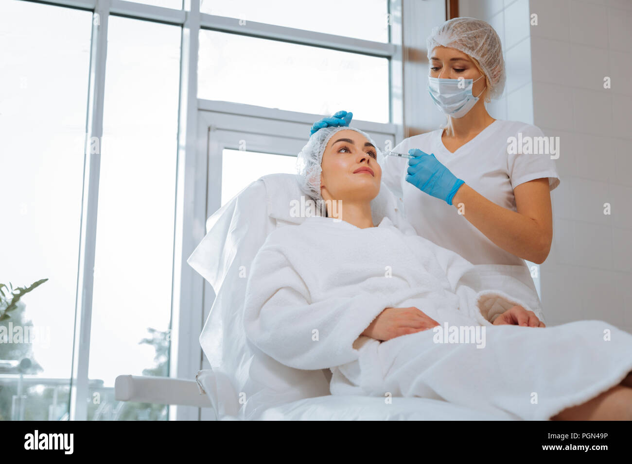 Woman having injection syringe hi-res stock photography and images - Alamy