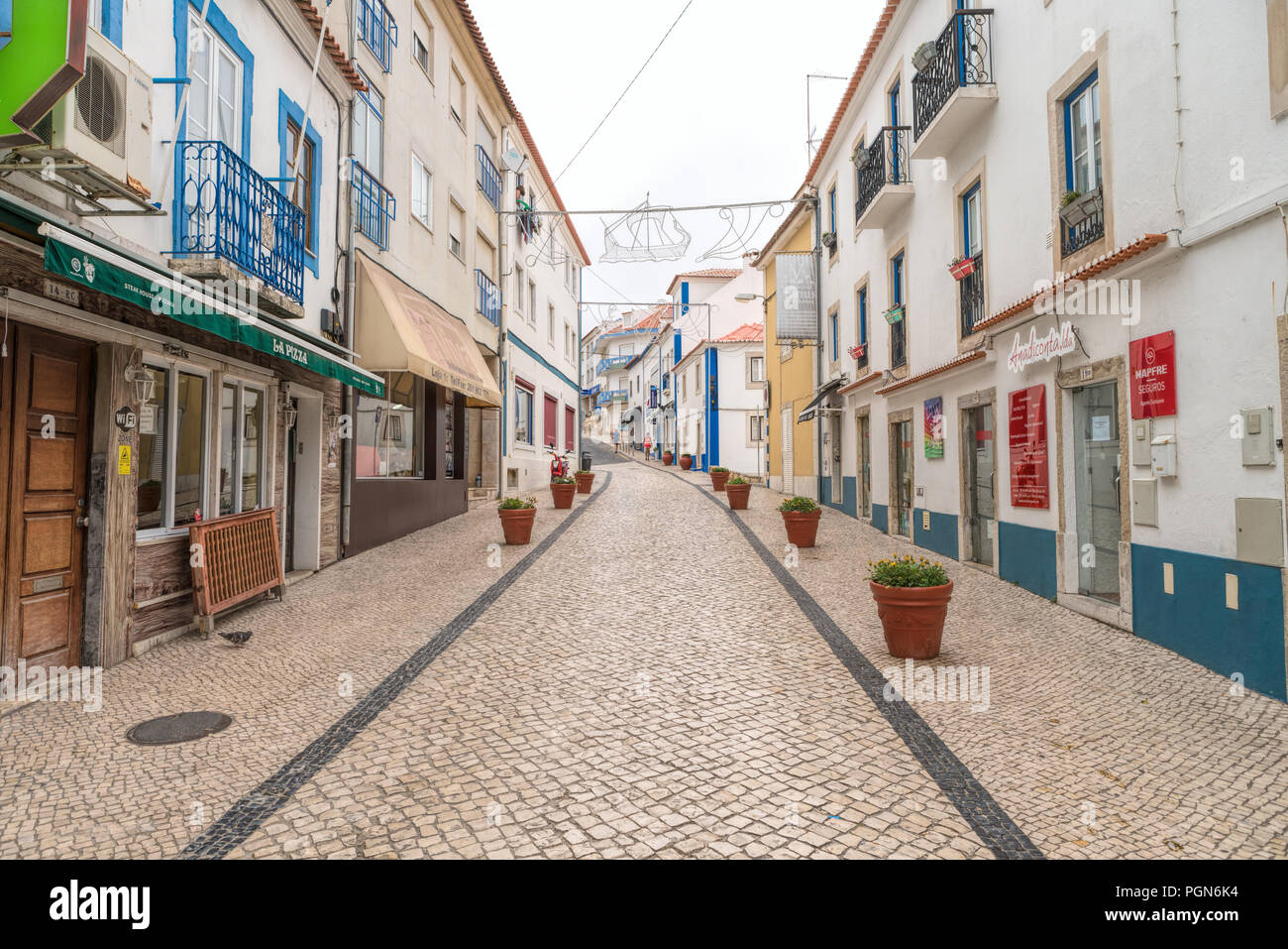 Typical street of Ericeira coastal town , travel and discover ...