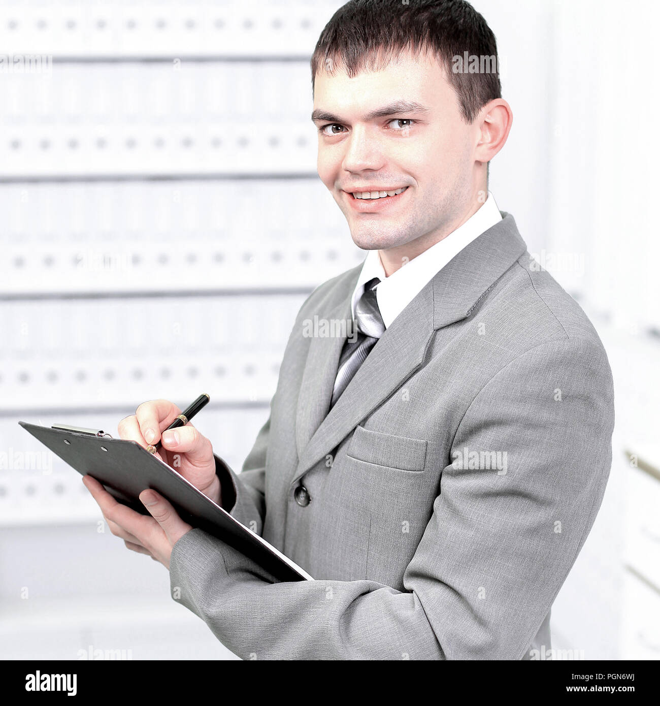 Office worker records work plan for a week Stock Photo - Alamy
