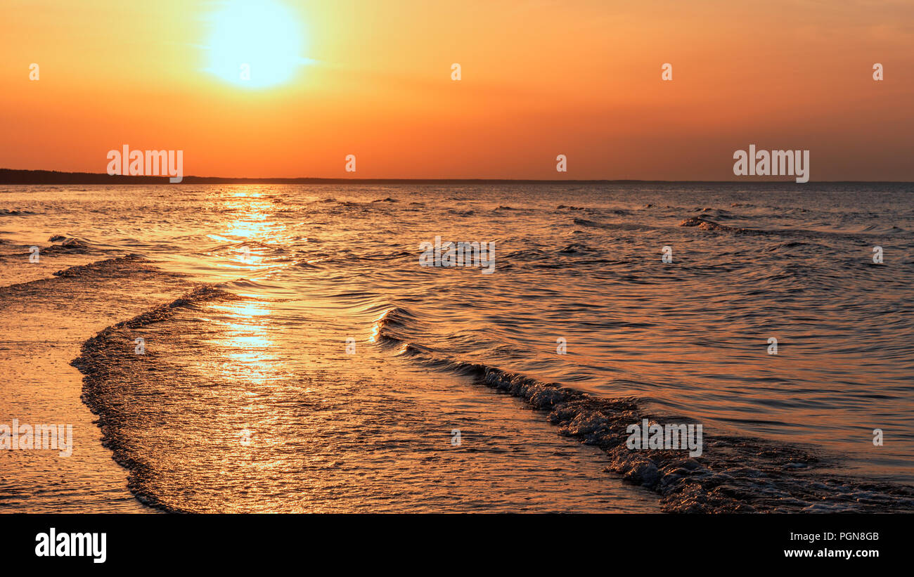 Sun with dark clouds over the baltic sea hi-res stock photography and ...