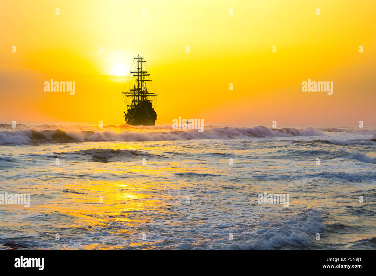 Old ship silhouette in sunset scenery Stock Photo - Alamy