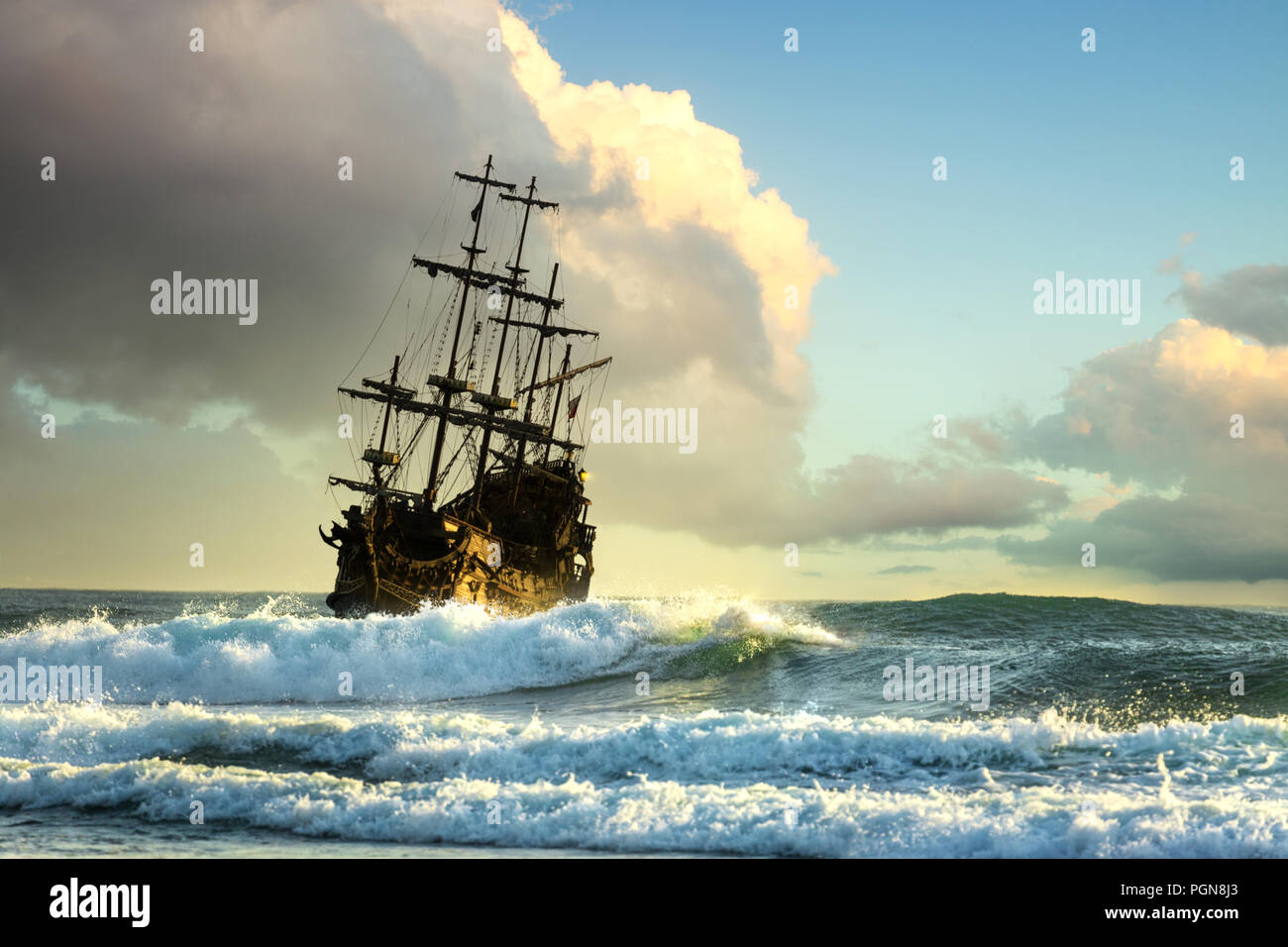 Old ship silhouette in sunset scenery Stock Photo - Alamy