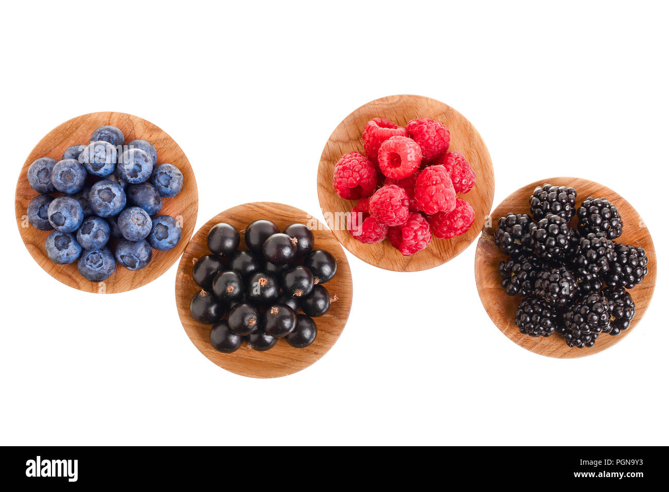blackberry blueberry raspberry black currant in wooden bowl isolated on ...