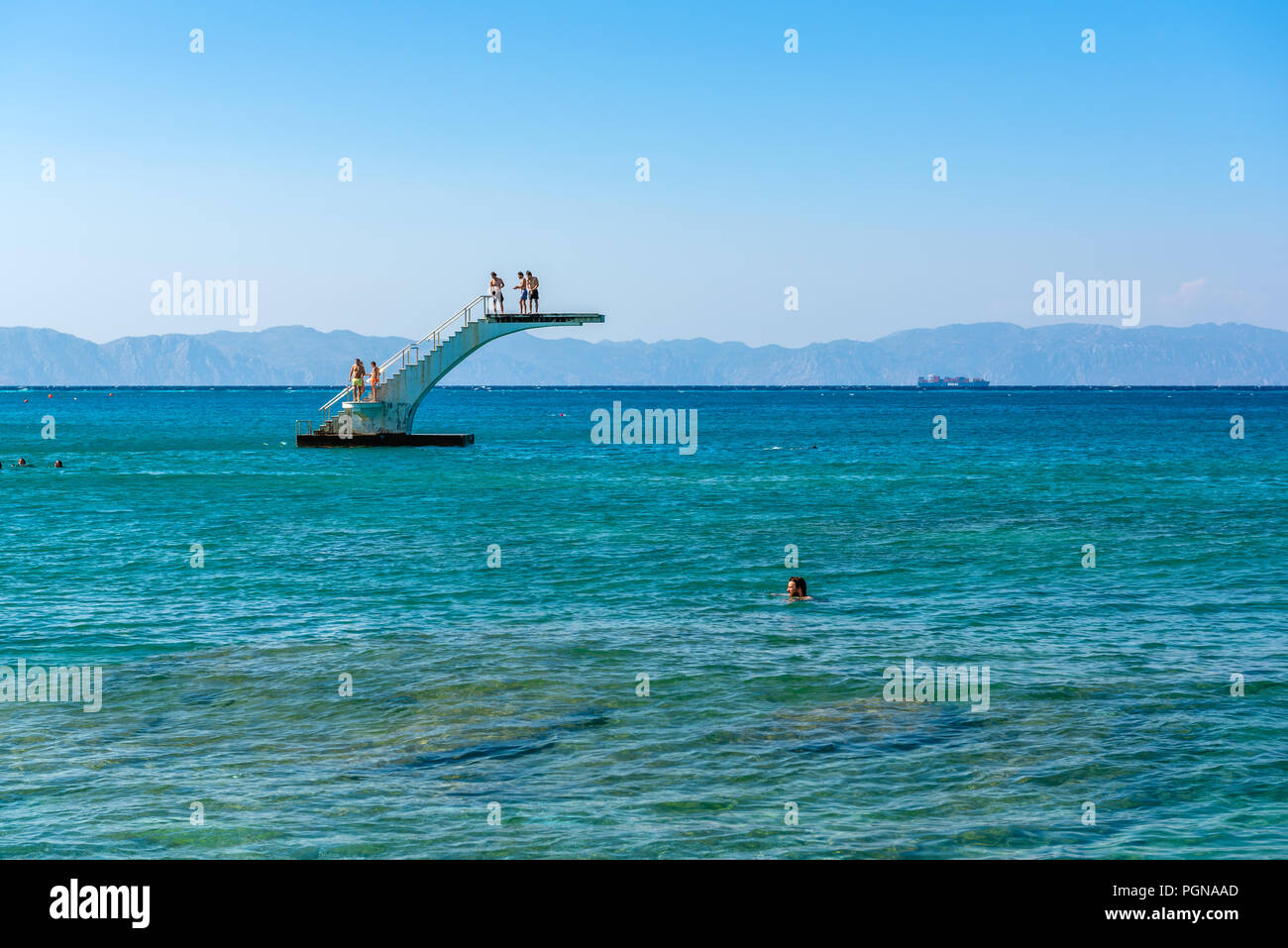 RHODES, GREECE - May 13, 2018: Young people on a sea diving platform ...