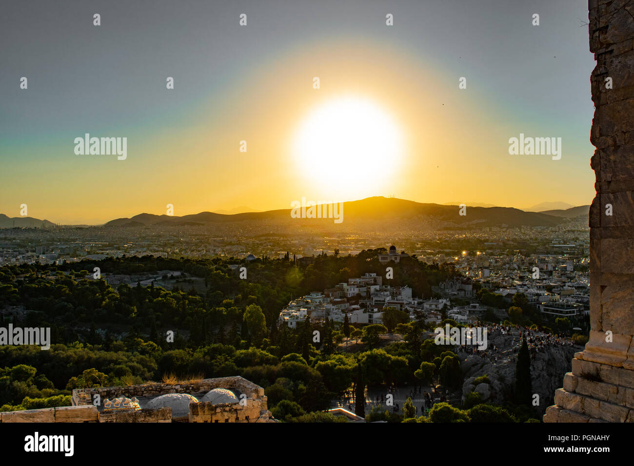 The city of Athens seen from the top of the Parthenon hill at sunset ...