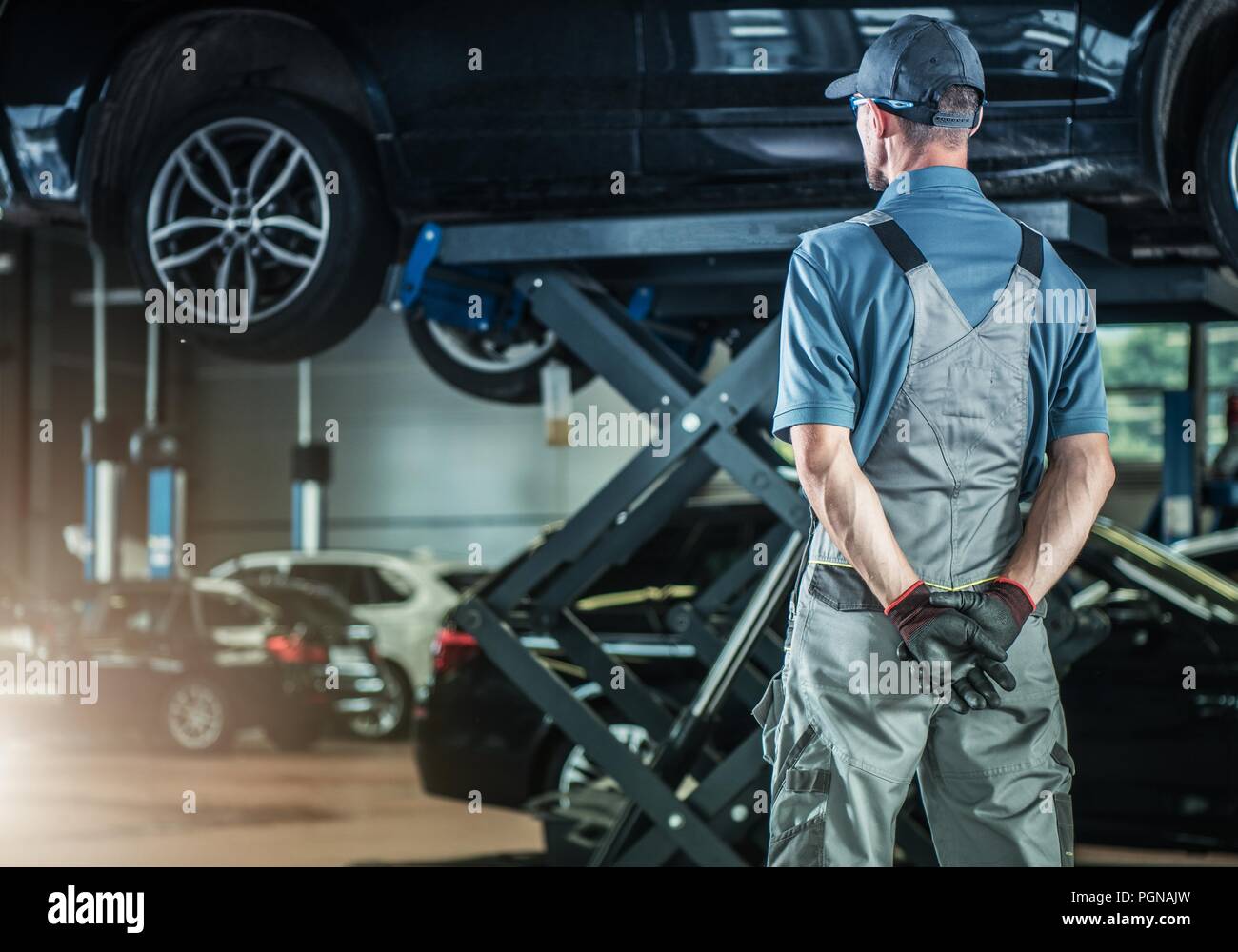 Auto Service Business. Caucasian Supervisor in His 30s Inside Vehicles ...