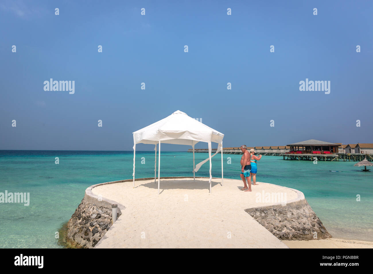 Maldives, Feb 8th 2018 - Tourists enjoying a calm beach, blue water ...