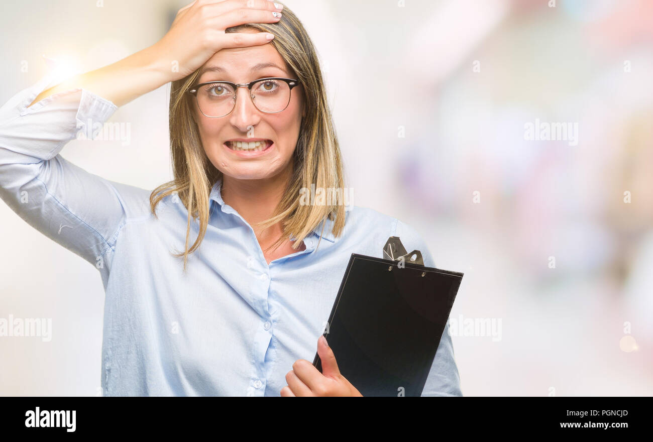 Young beautiful inspector business woman over isolated background ...