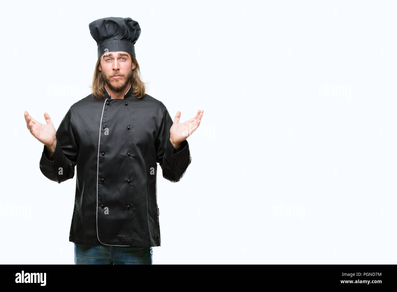 Young handsome cook man with long hair over isolated background ...