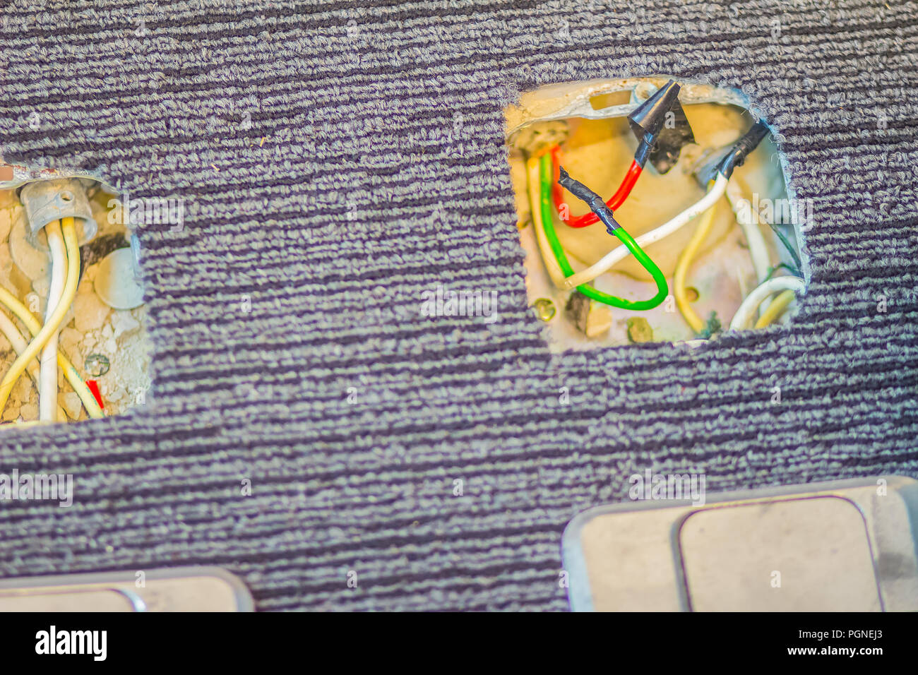 View of pop up floor outlet socket during installation. Opened pop up ...