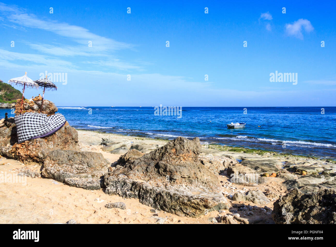 Shrine and boat, Bingin beach, Bali, INdonesia Stock Photo - Alamy
