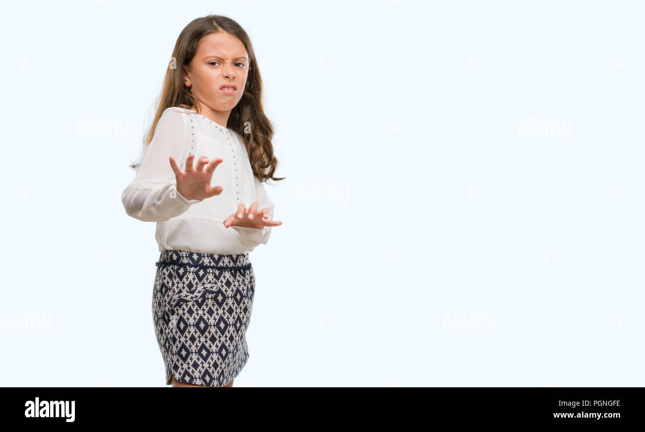 Brunette hispanic girl disgusted expression, displeased and fearful ...