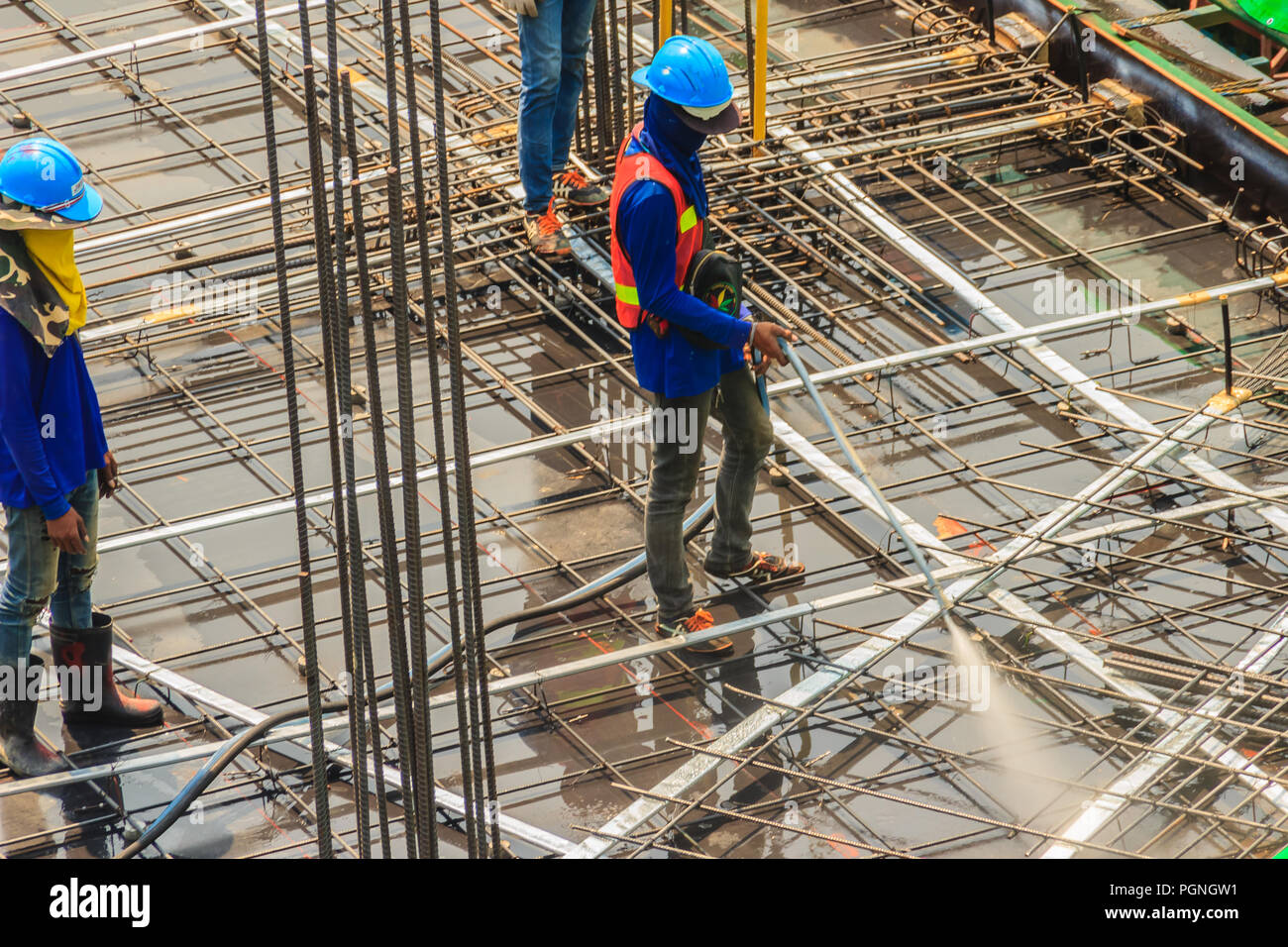 Unidentified worker used the high pressure machine to clean floor slab ...