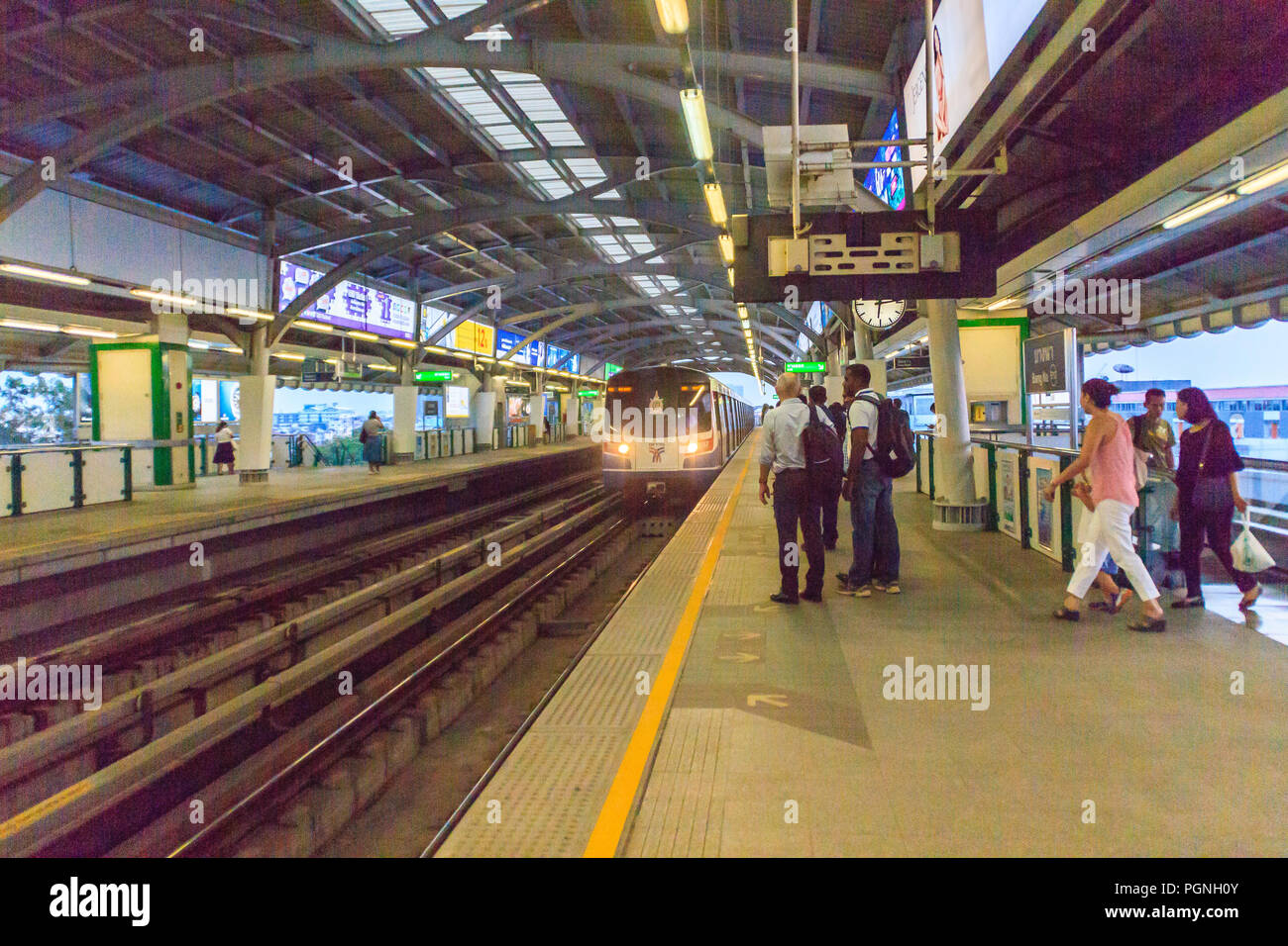 Bangkok, Thailand - February 28, 2017: Passengers wait for BTS Skytrain ...