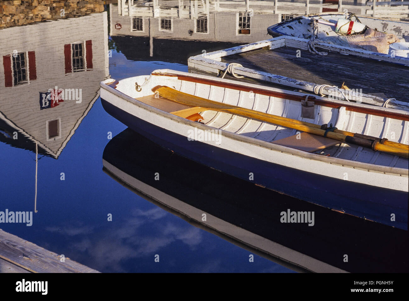 Reflection of Robin Hood Marina buildings and boats docked at Robin ...