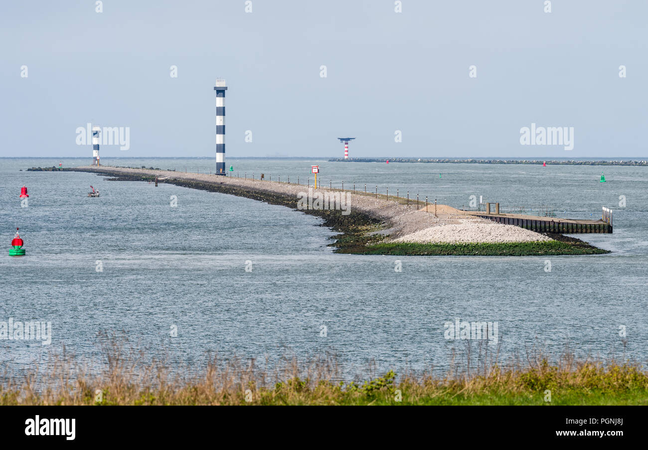 The entrance of the Port of Rotterdam in the Netherlands with dams and ...