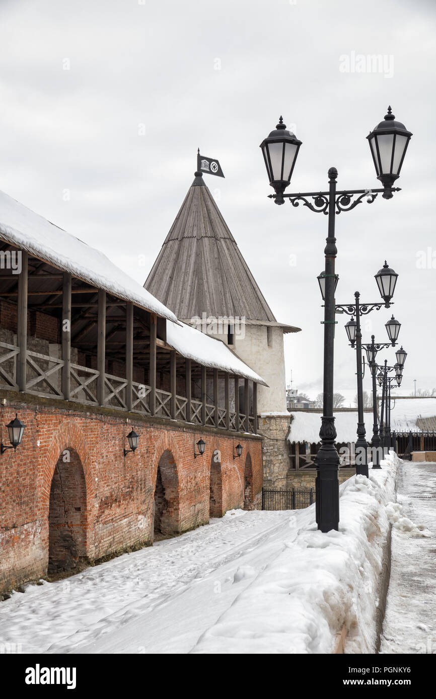 Fortress wall of the Kazan Kremlin from red brick with a gallery with a ...