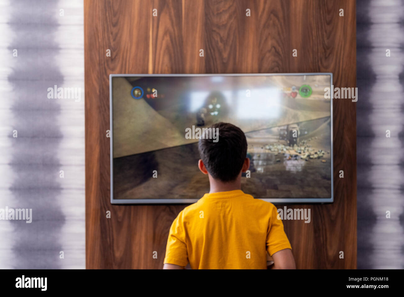 Kids playing video game on console Stock Photo - Alamy