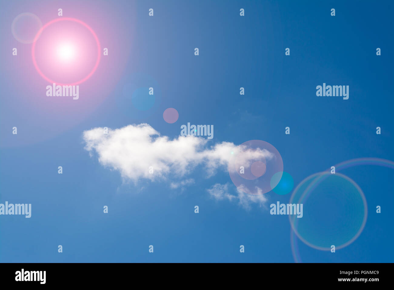 Cloud on blue sky with lens flare Stock Photo - Alamy