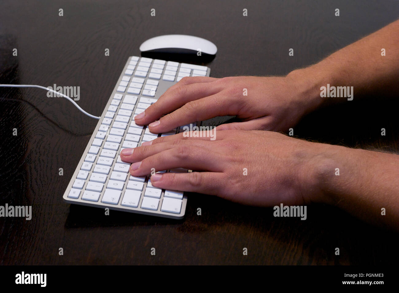 Typing Hands on a Desk with Mouse and Keyboard Stock Photo - Alamy