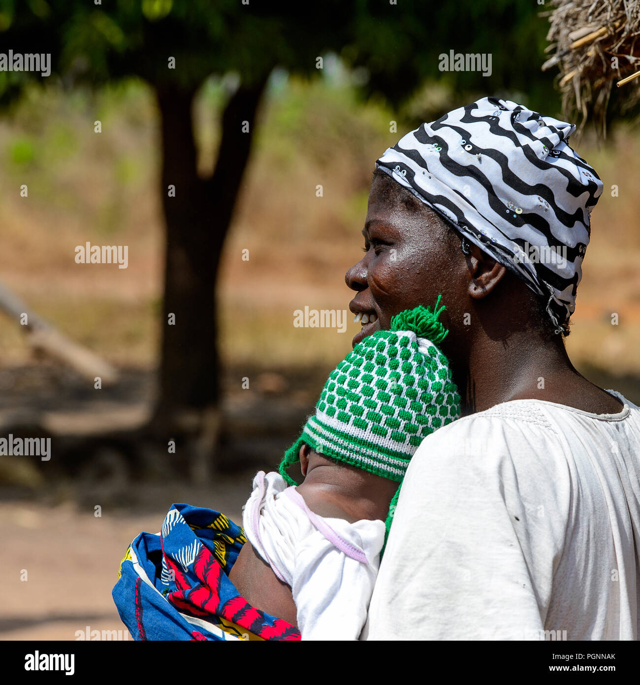 KARA REG., TOGO - JAN 14, 2017: Unidentified Konkomba woman carries a ...