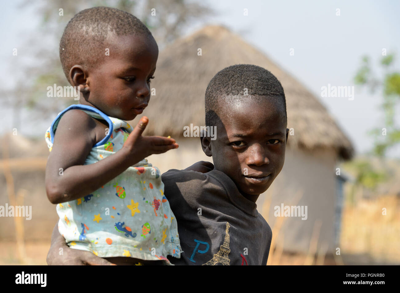 GHANI, GHANA - JAN 14, 2017: Unidentified Ghanaian boy carries his ...