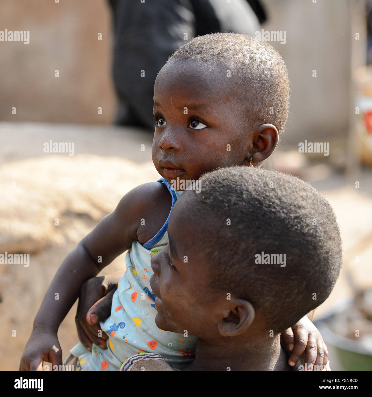 GHANI, GHANA - JAN 14, 2017: Unidentified Ghanaian boy carries his ...