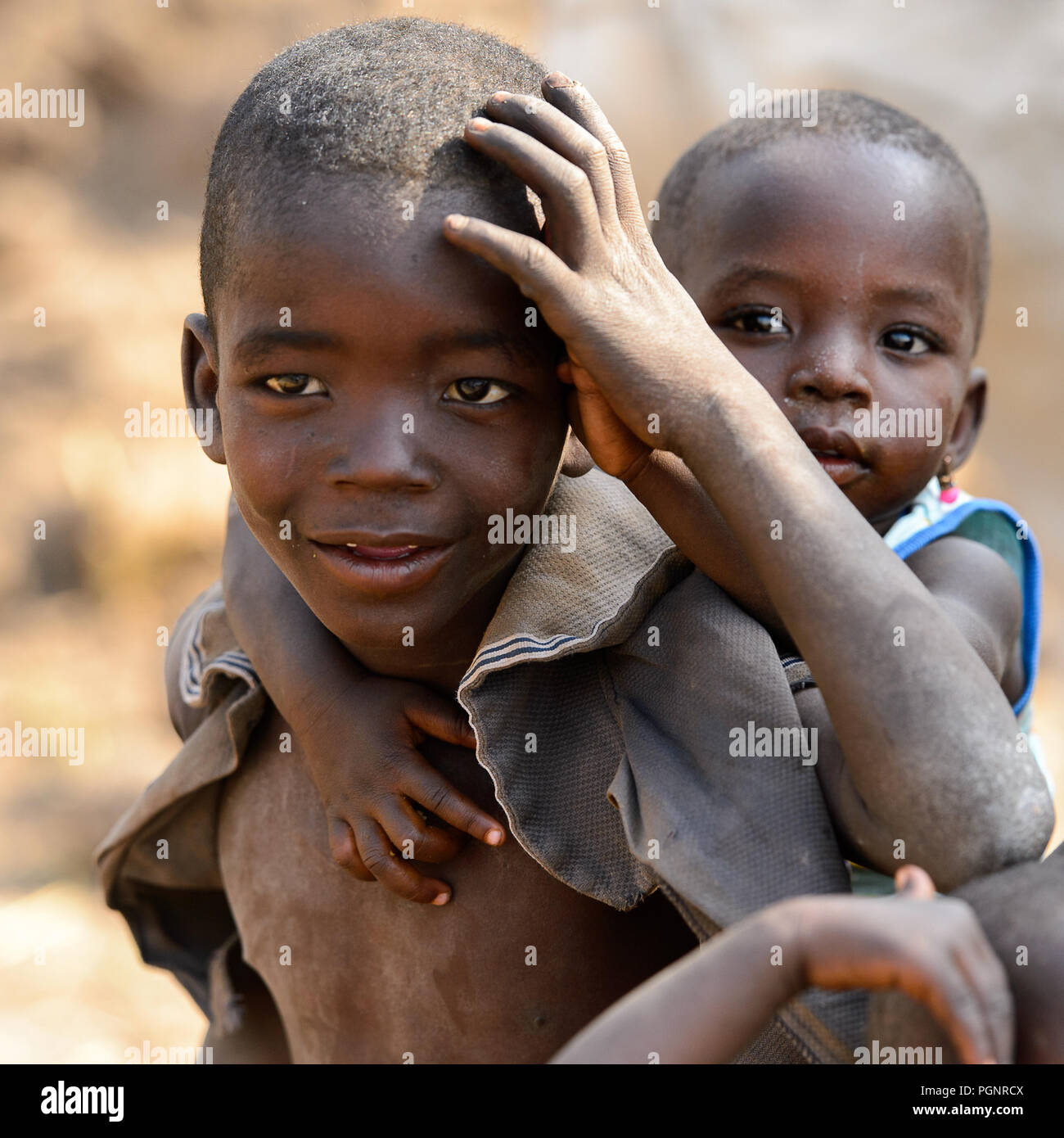 GHANI, GHANA - JAN 14, 2017: Unidentified Ghanaian boy carries his ...